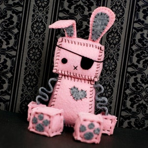 Pink Punk Robot Bunny With an Eye Patch, Bunny Ears and Paw Prints ...