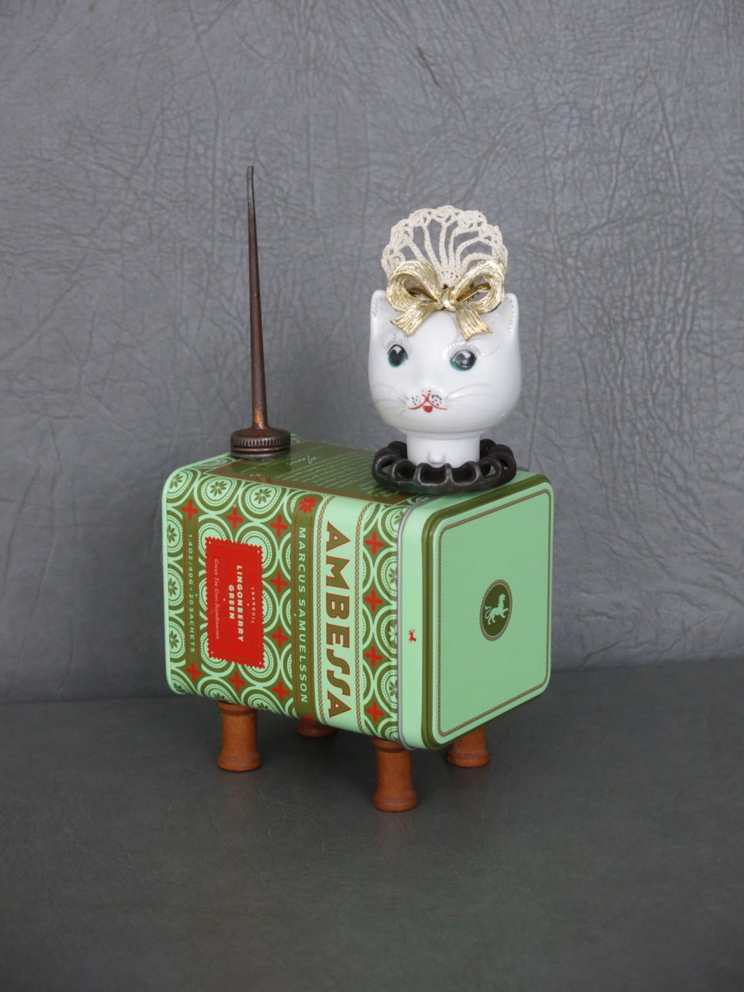 Assemblage Cat. "ambessa." Porcelain Cat Head, Tea Tin, Wooden Spools ...