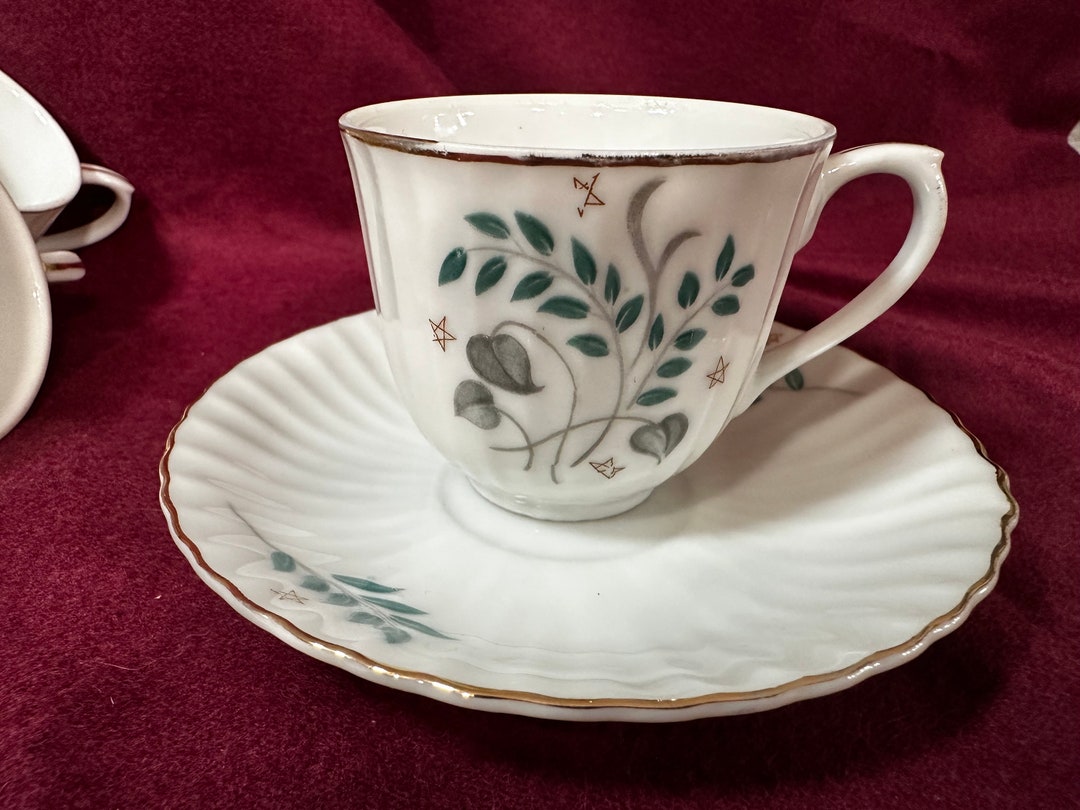 Tiny Tea Set of Cups and Saucers With Sprays of Blue Flowers. One ...