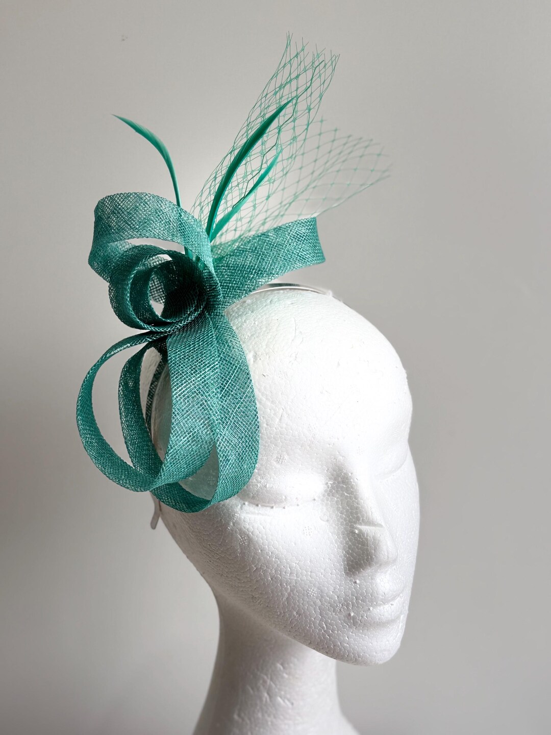 New Aqua Green Loop Fascinator With Netting and Feathers on a Silver ...
