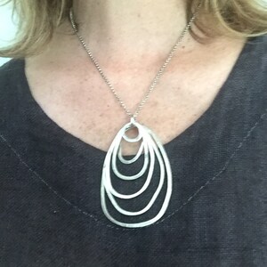 Sterling Silver Overlapping Loops Pendant on Chain. - Etsy