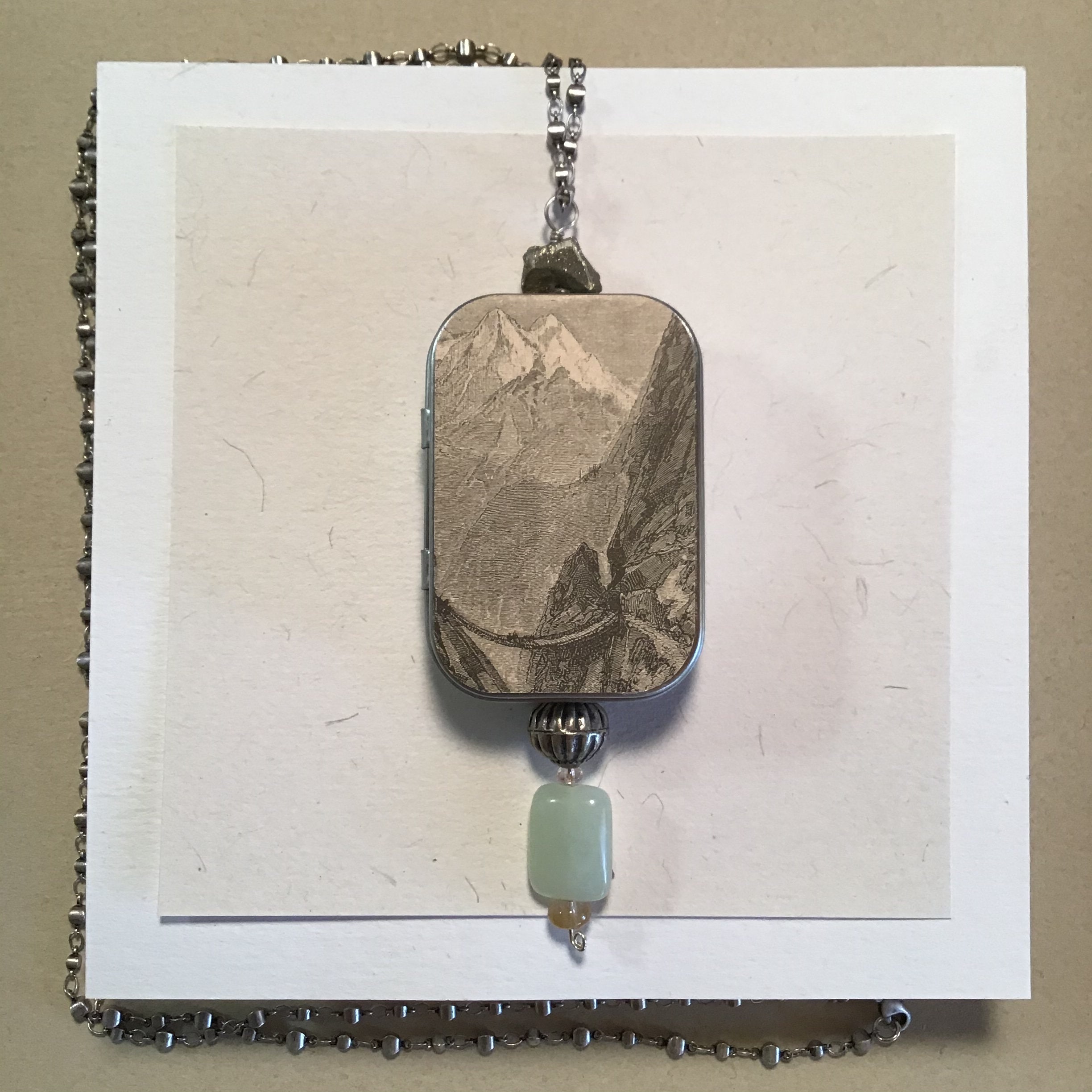 An EMA Watercolor Travel Locket