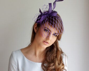 Modern fascinator gold fascinator serpentine shape