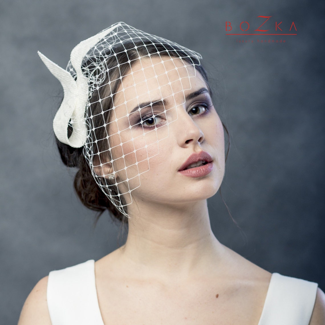 Modern Wavy Wedding Fascinator With Small Bow and Merry Widow Veiling ...