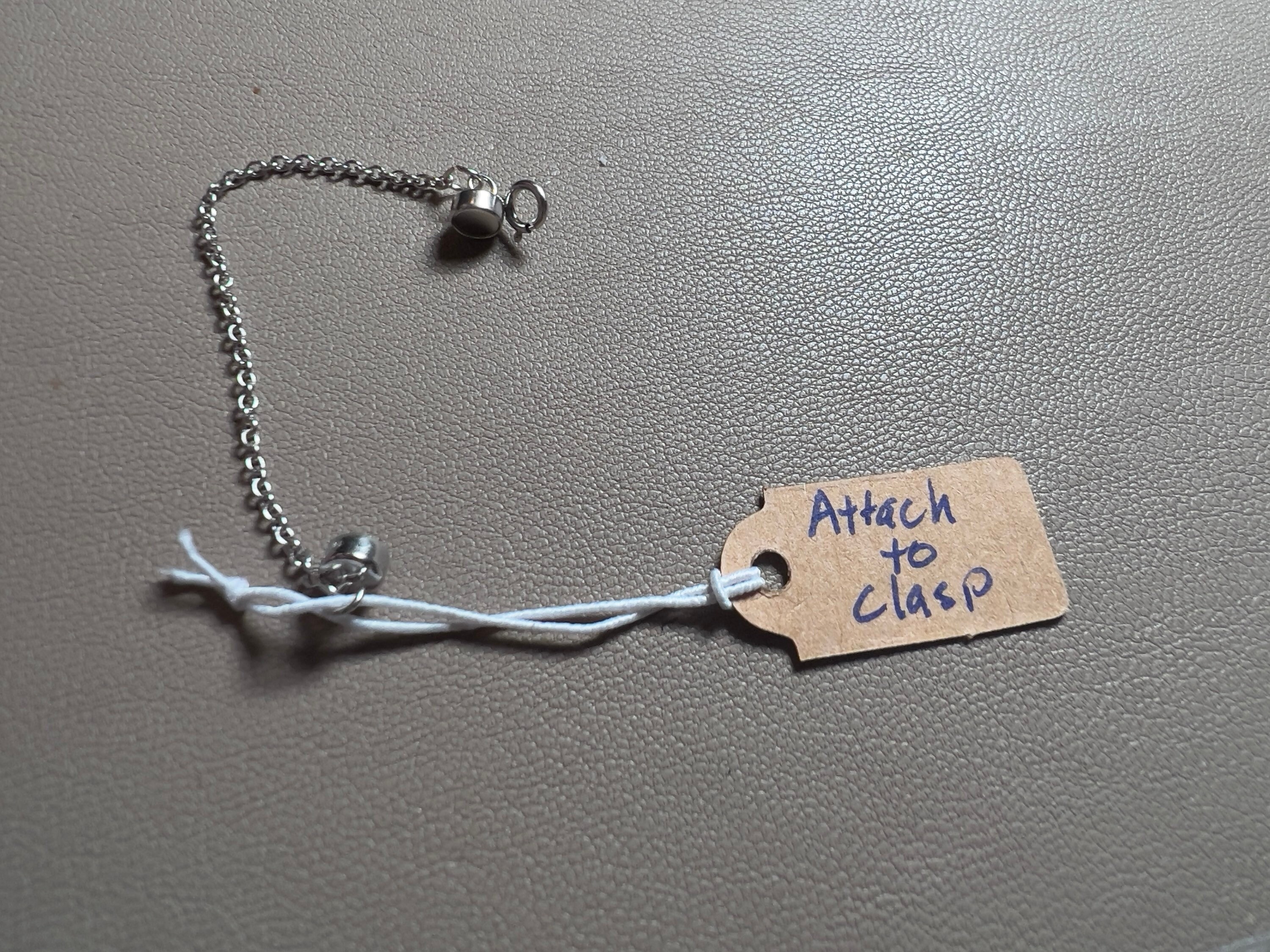 Magnetic necklace clasps with safety catches store