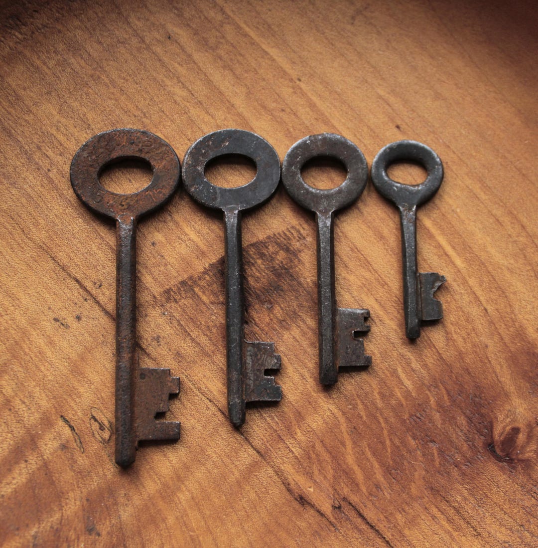 Set of Four Antique Iron Keys Graduating Sizes. Rusty Old Keys. Varying ...
