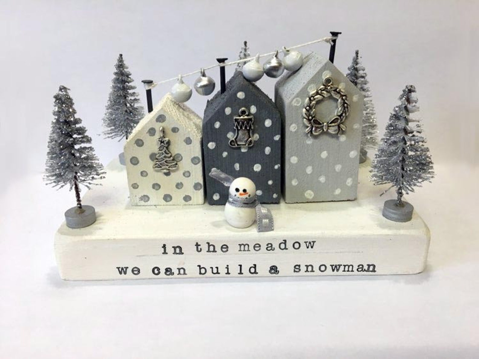 Miniature Wooden Houses on Plinth 'in the Meadow We Can Build a Snowman ...