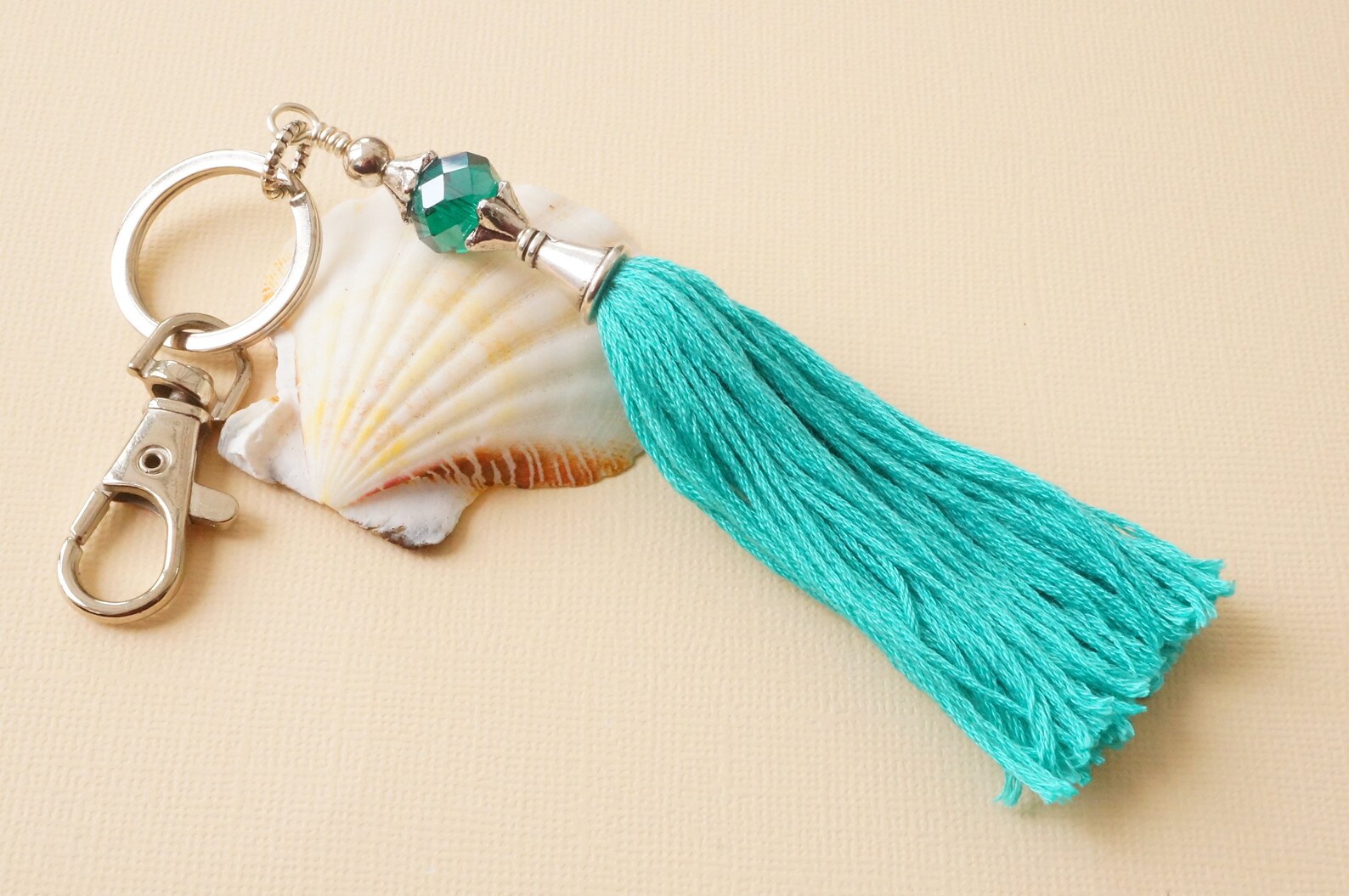Teal green tassel bag charm and keyring with a faceted crystal | Etsy