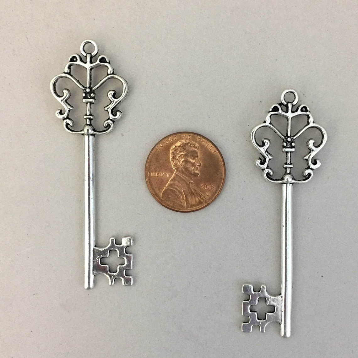 BULK 12 Silver Skeleton Key Charm by TIJC SP0110B | Etsy