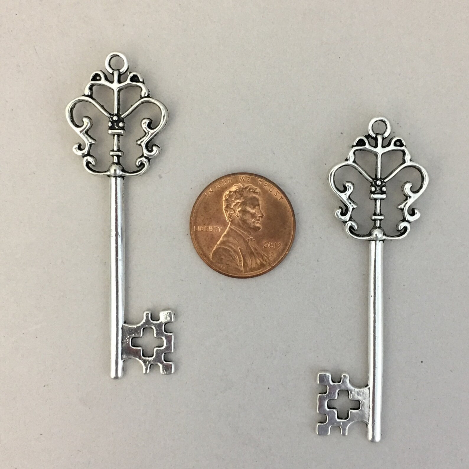 BULK 12 Silver Skeleton Key Charm by TIJC SP0110B | Etsy