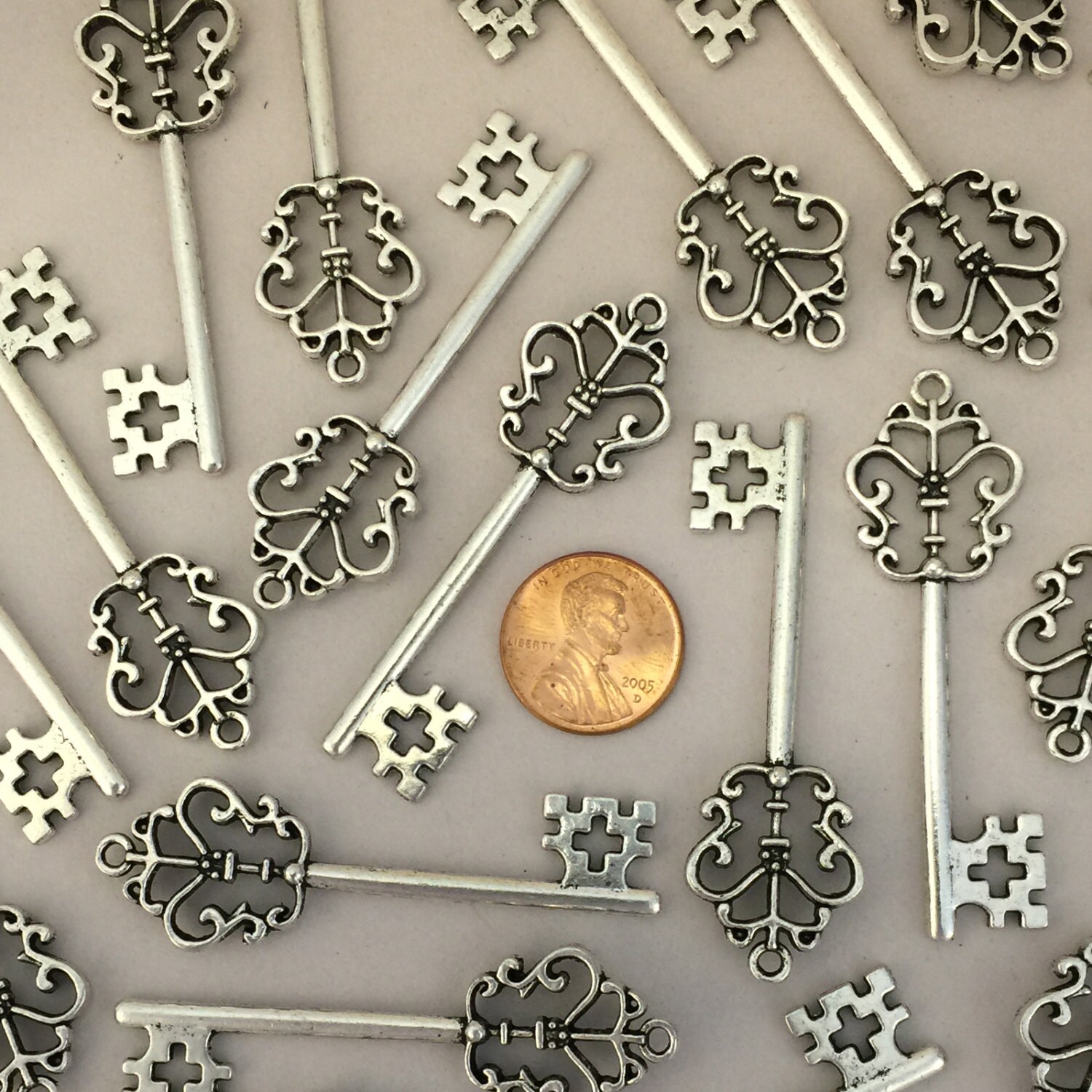 BULK 12 Silver Skeleton Key Charm by TIJC SP0110B | Etsy