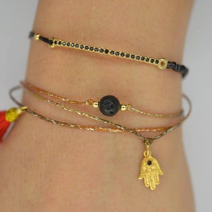 Waxed Metallic Thread Charm Bracelet With a Volcanic Rock and a ...