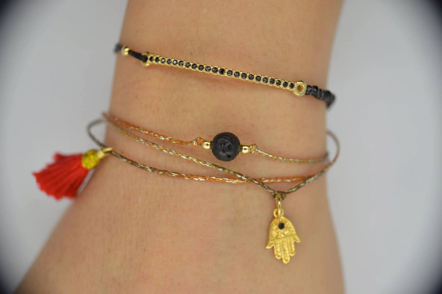 Waxed Metallic Thread Charm Bracelet With a Volcanic Rock and a ...