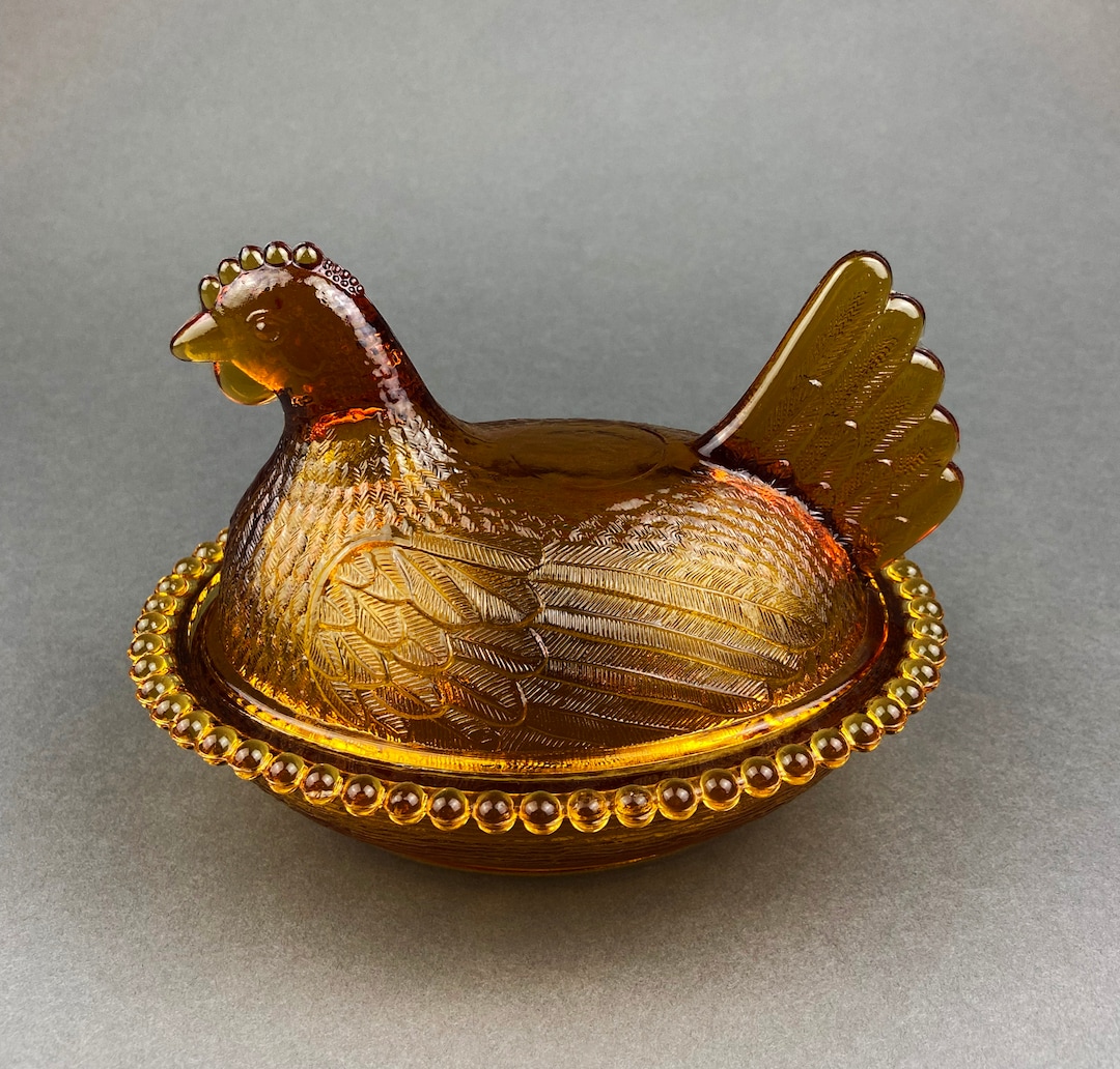 Glass Hen on Nest. Golden Yellow Colored Glass Chicken in a Basket ...