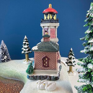 Illuminated Lighthouse. Christmas Village House. Home or Retail Holiday ...