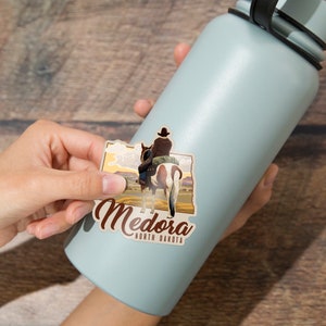 Sticker, Medora, North Dakota, Cowboy on Ridge, Contour, Lantern Press ...