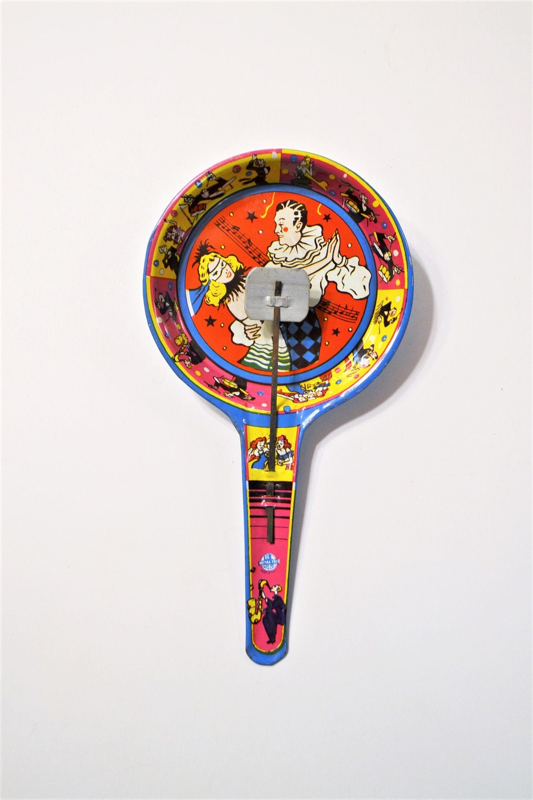 Vintage Tin Noisemaker Dancing Man Woman US Metal MFG Co Toy Clacker ...