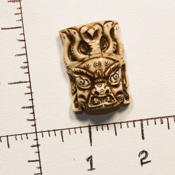 smallest and finest Maha kala yak bone carving button - Gem
