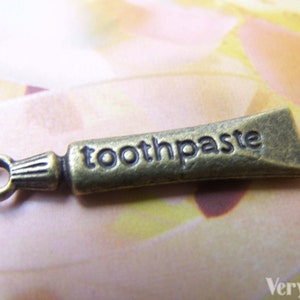 10 Pcs of Antique Bronze Toothpaste Charms 7x28mm A2914 - Etsy