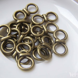 20 Pcs of Antique Bronze Figure 8 Connector Charms 9x19mm A4760 - Etsy