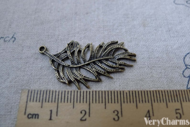 10 Pcs of Antique Bronze Filigree Feather Charms 19x37mm A7737 - Etsy