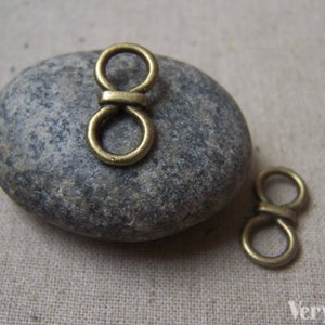20 Pcs of Antique Bronze Figure 8 Connector Charms 9x19mm A4760 - Etsy