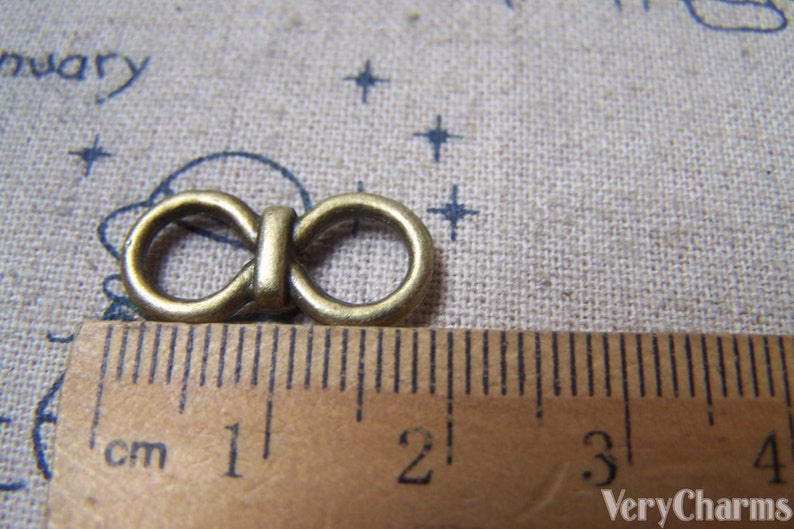 20 Pcs of Antique Bronze Figure 8 Connector Charms 9x19mm A4760 - Etsy