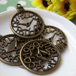 10 Pcs of Antique Bronze Filigree Clock Pendants Charms 30x39mm A476 - Etsy