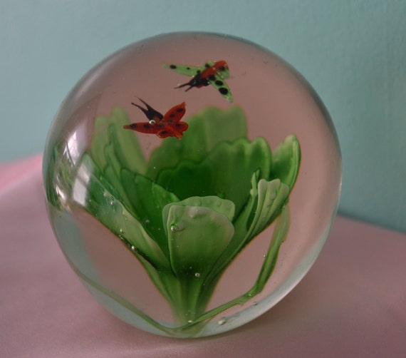Items similar to Vintage art glass paperweight with green flower and ...
