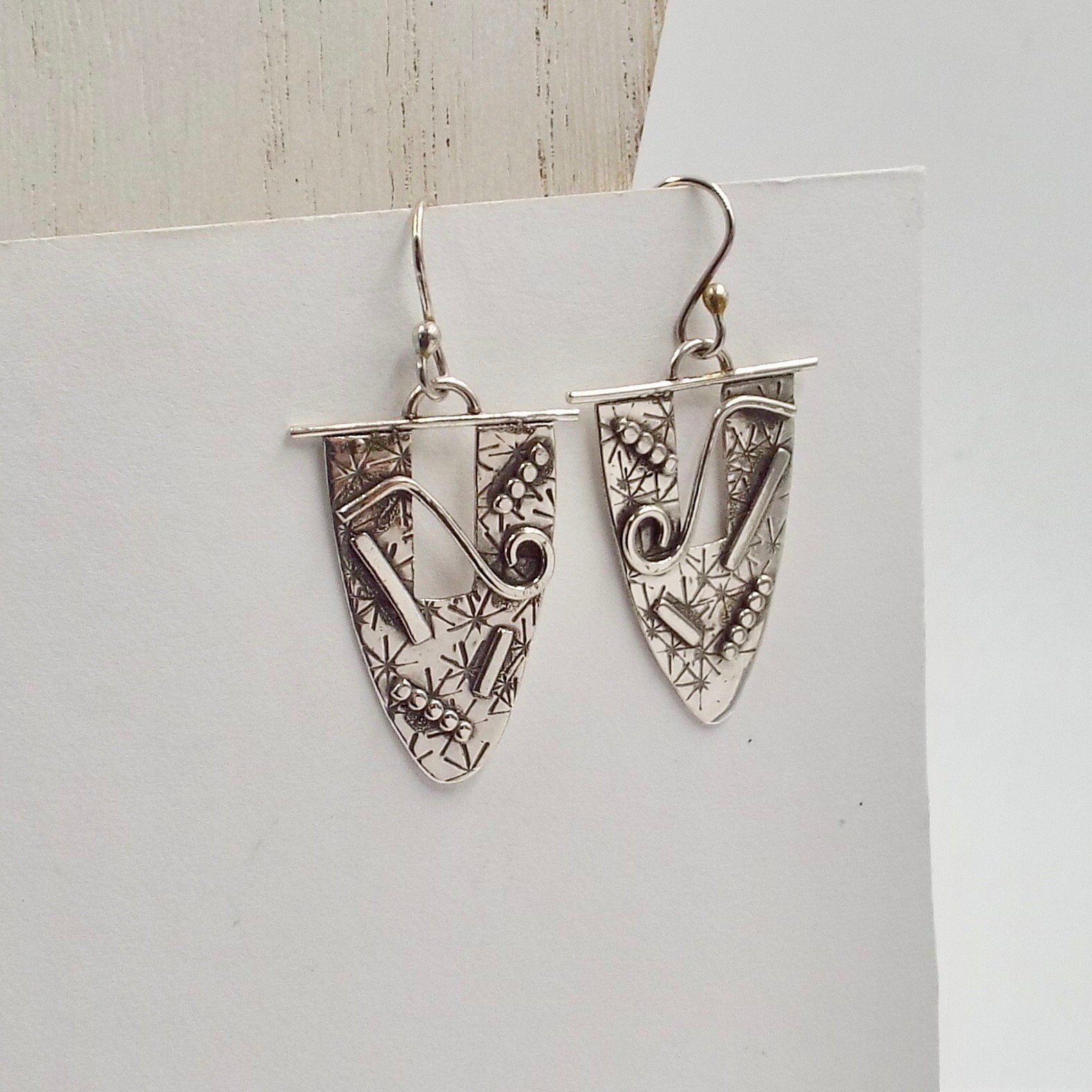 Shield Shaped Earrings With Spirals And Bead Wire Details