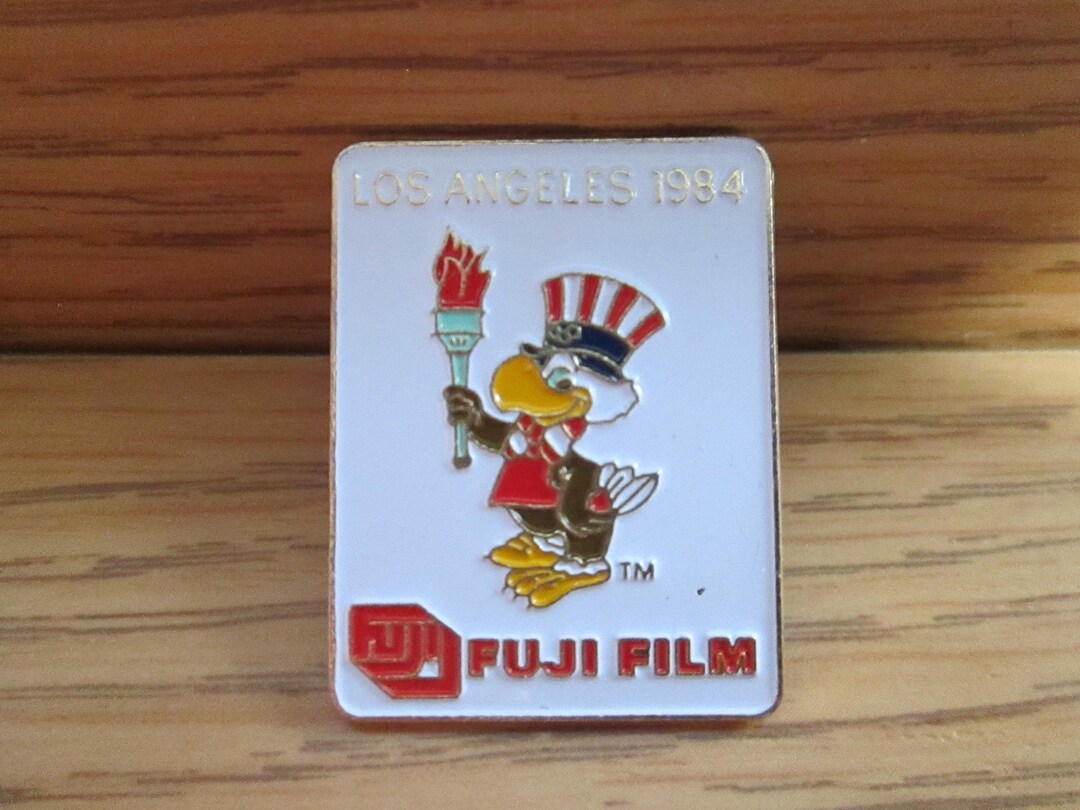 Vintage Olympic Sponsor Pin Fuji Film Official Mascot Sam the Bald ...