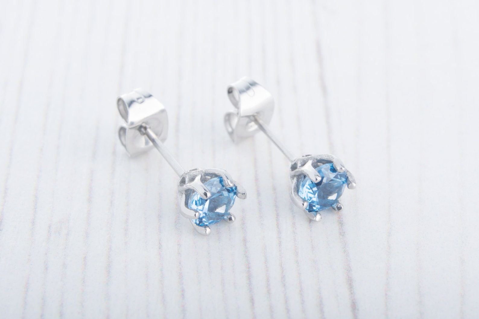 Genuine Blue Topaz Stud Earrings, Available in Titanium, White Gold and ...