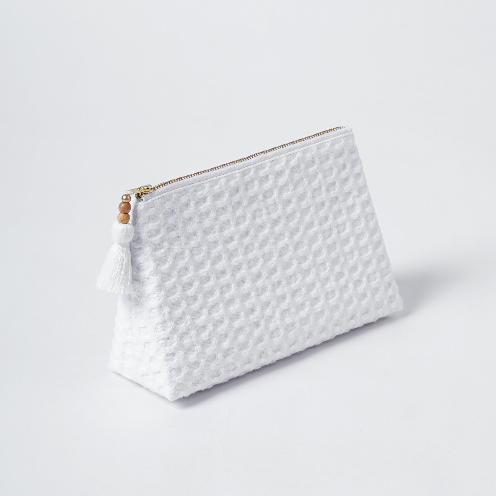 A Pair of White Waffle Nesting Pouches With Zipper Closure and Tassel ...