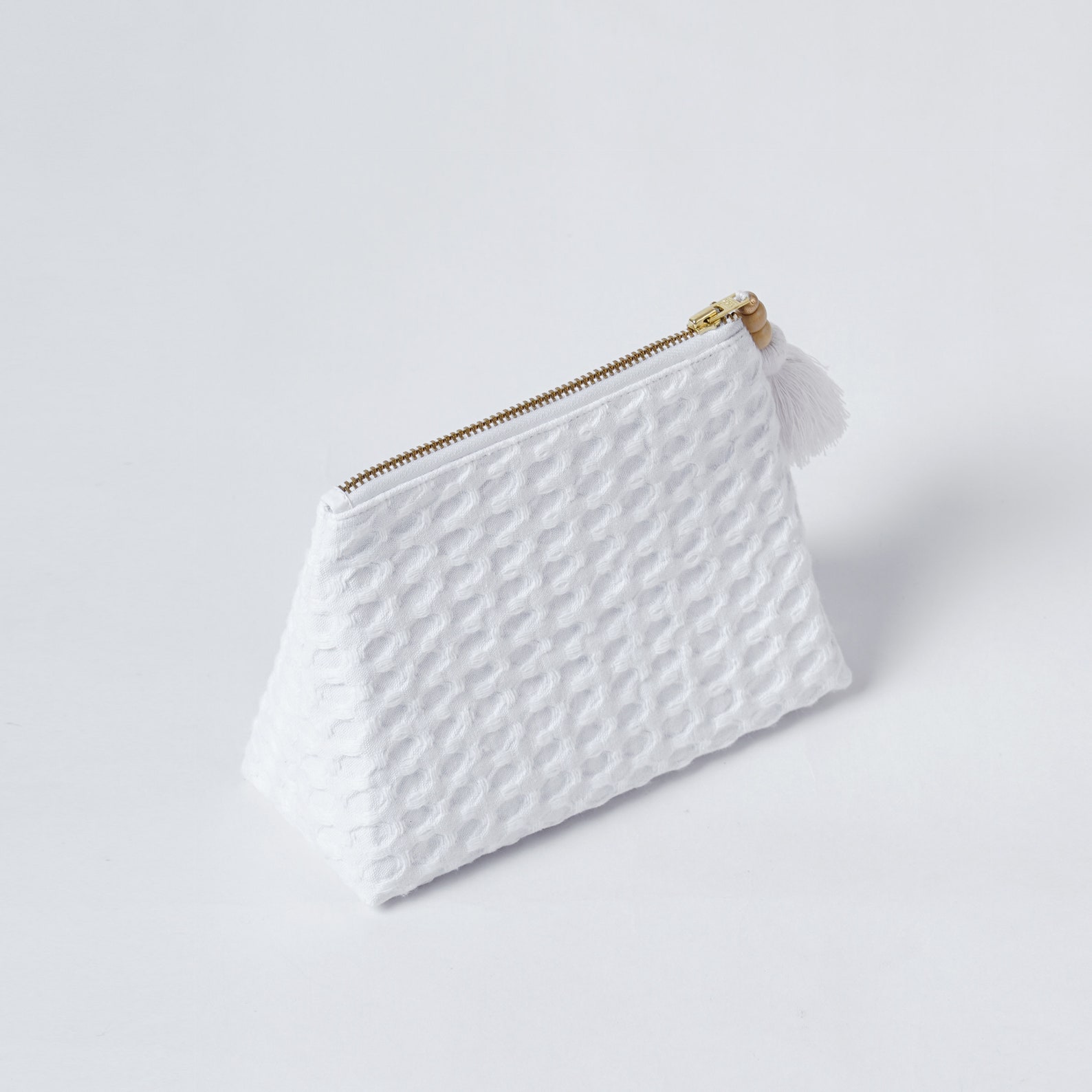 A Pair of White Waffle Nesting Pouches With Zipper Closure and Tassel ...
