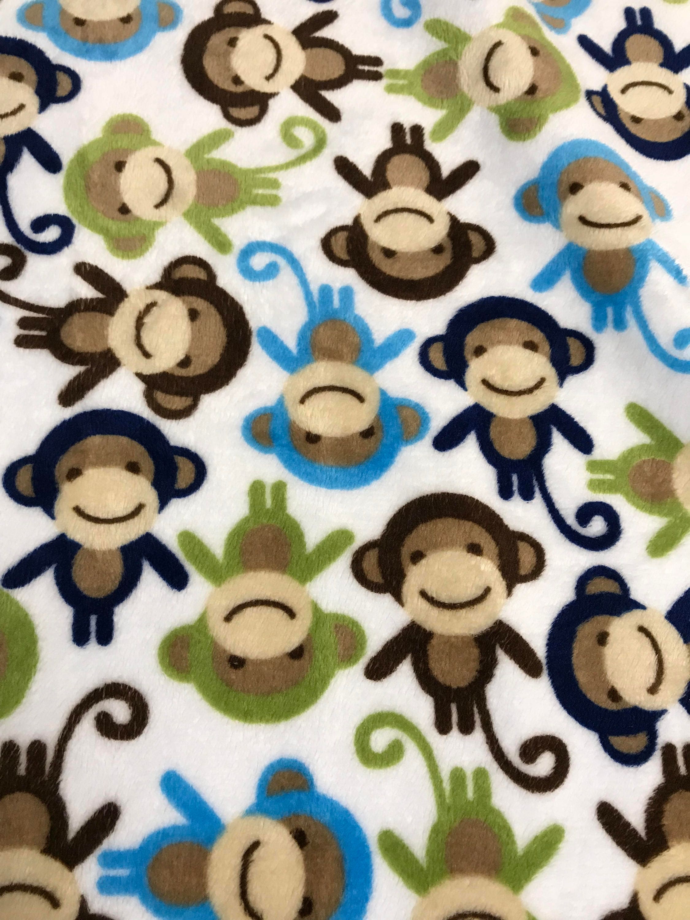 Monkeys all around minky baby blanket with navy satin backing and binding