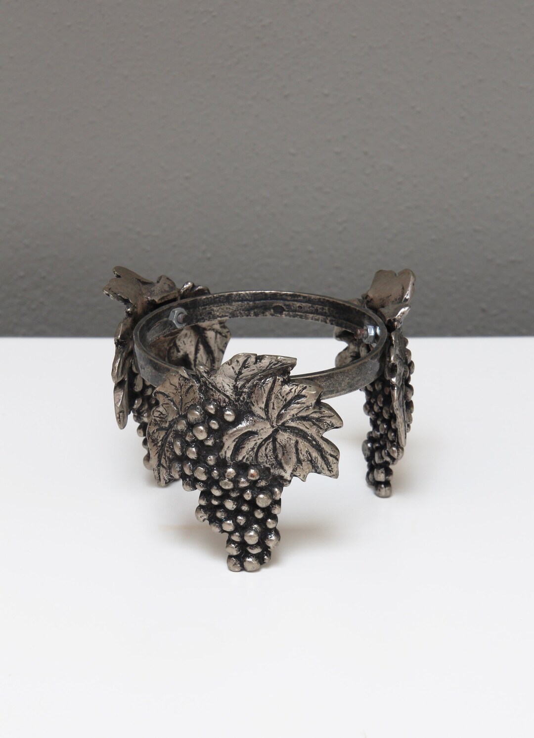 Grape Stand: A Bunch of Grapes Are Recreated in Antique Nickel to ...