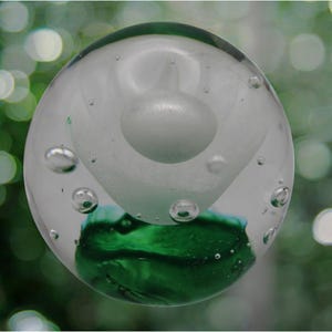 Dynasty Gallery Art Glass Paperweight With Green Swirl & White Petal ...