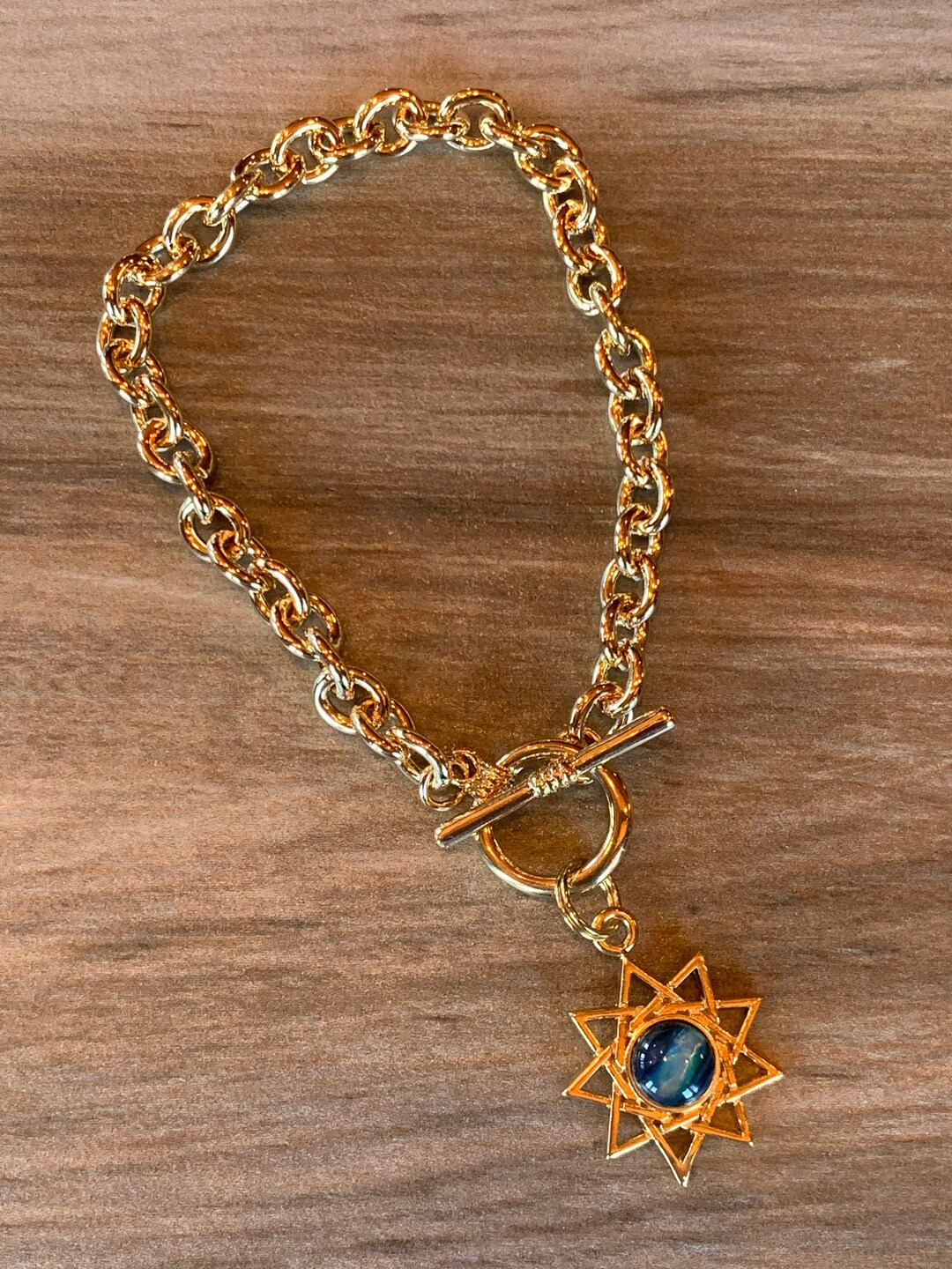 Nine Point Star Gold Plated Toggle Bracelet With Blue Paua Shell ...