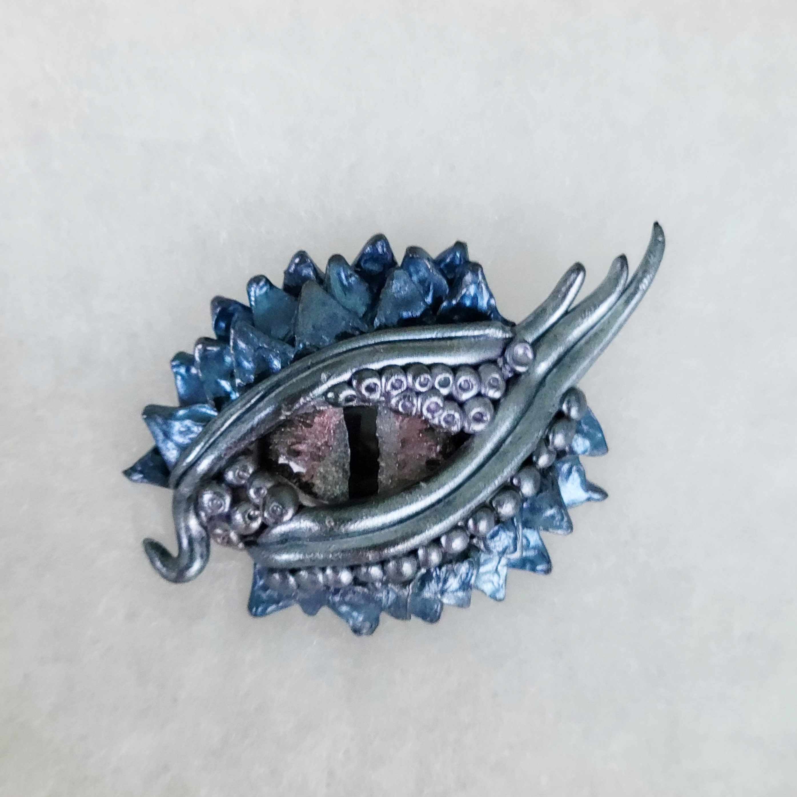 Blue Eyed Silver Dragon