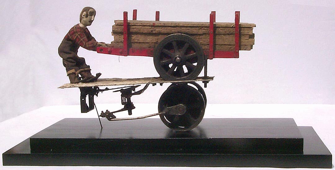 Folk Art Carving of a Man on Wood Wagon From an Extraordinary Logging ...