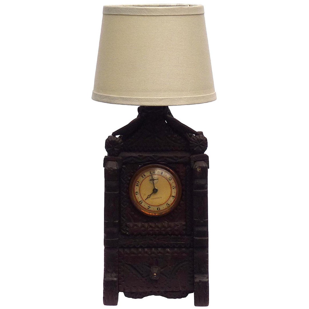 A Tramp Art Lamp With Clock and Drawer. Decorated With Carved Birds ...
