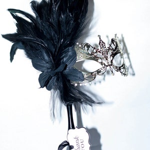 Gold Masquerade Mask With a Stick Mask Handle With Black Feathers ...