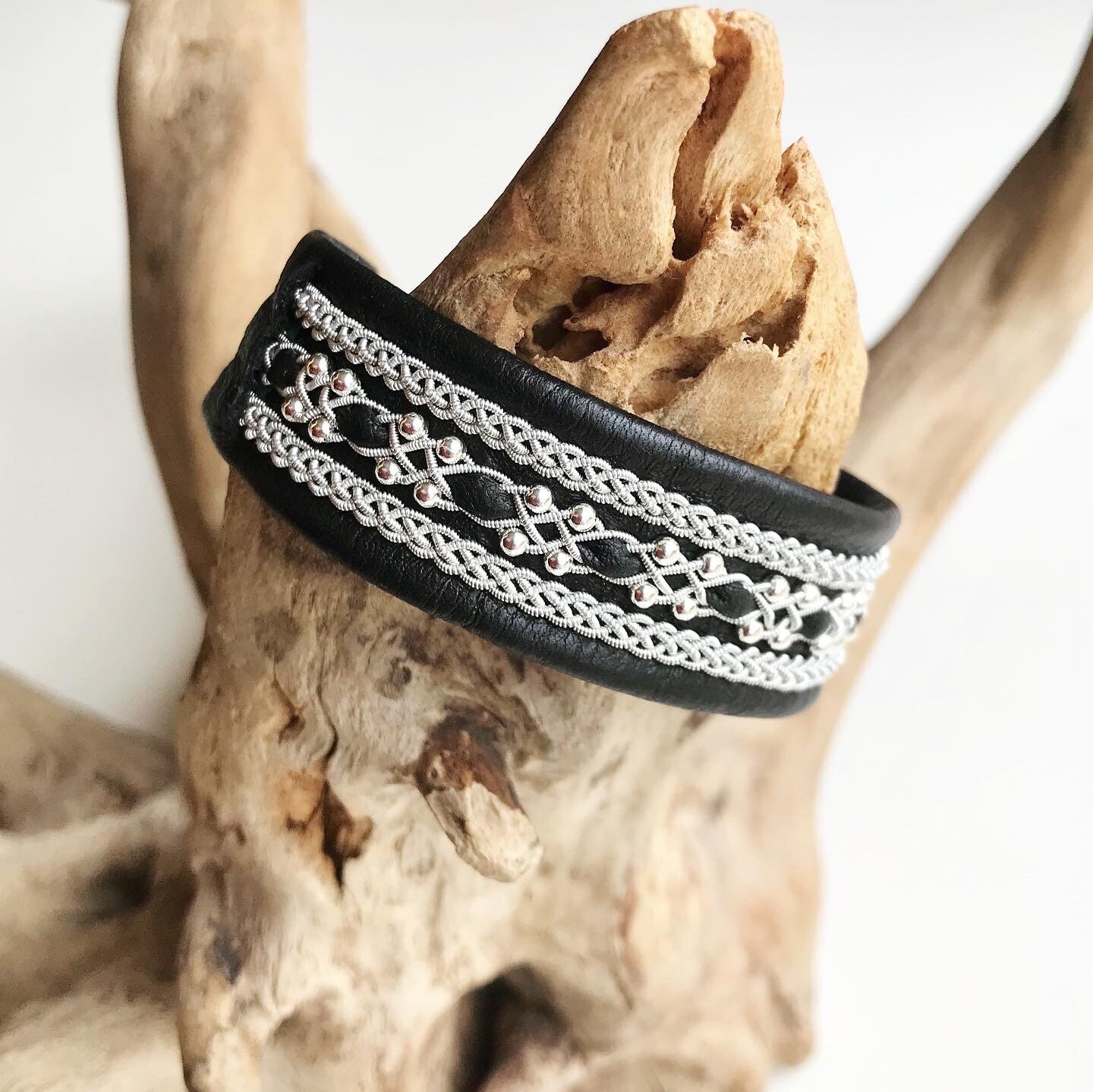 Traditional Sami leather cuffs, with three braids of spun pewter and ...