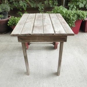 Primitive Wooden Table With Red Wooden Wheels Distressed Rustic ...