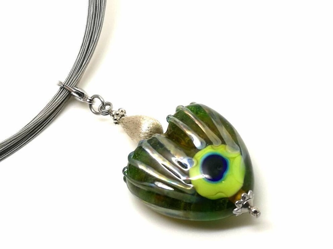 Colgante de pavo real en Reif - Etsy España