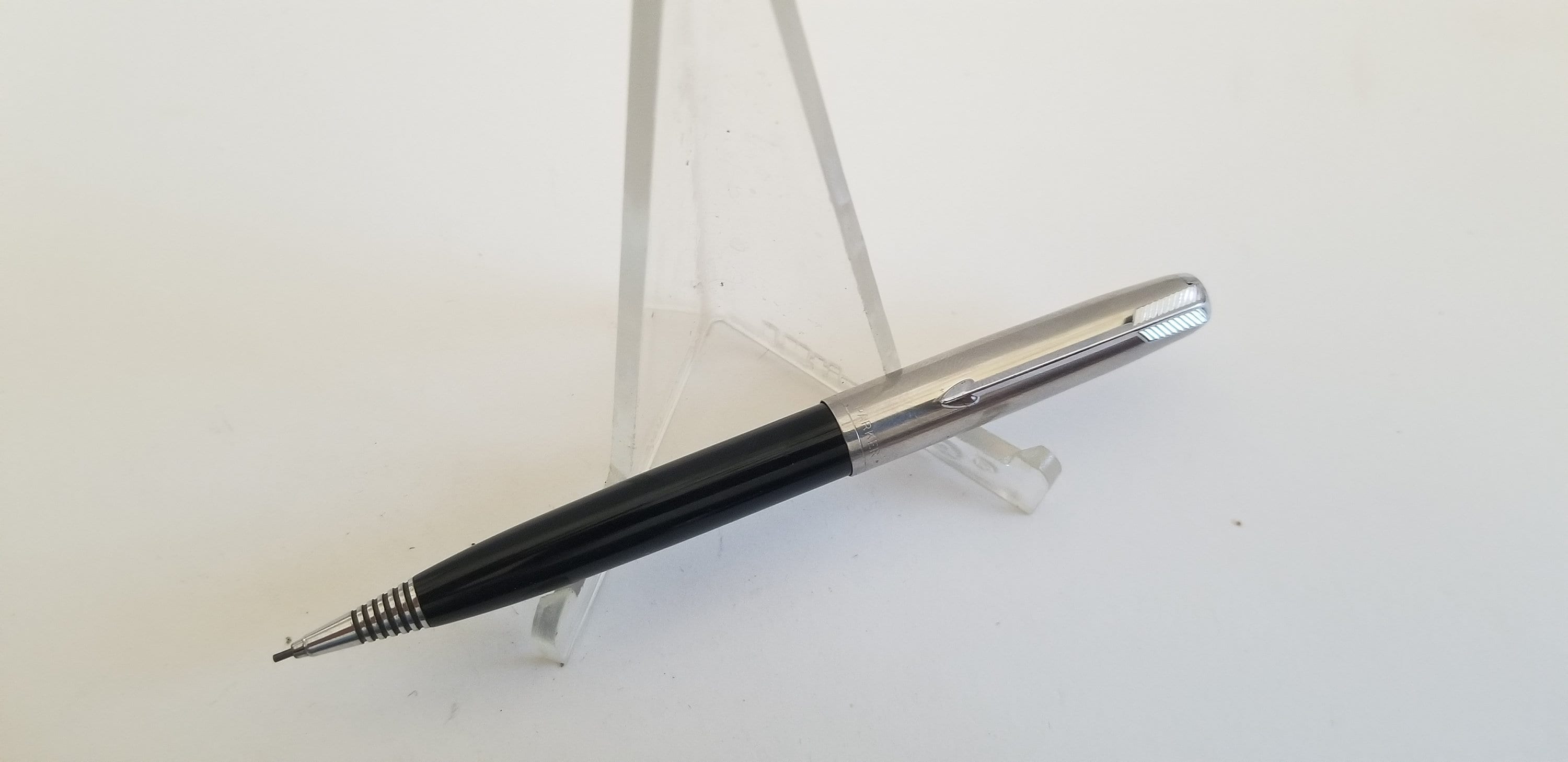Mechanical pencil with cap store