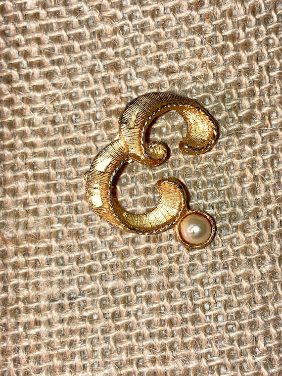 E In Cursive Capital