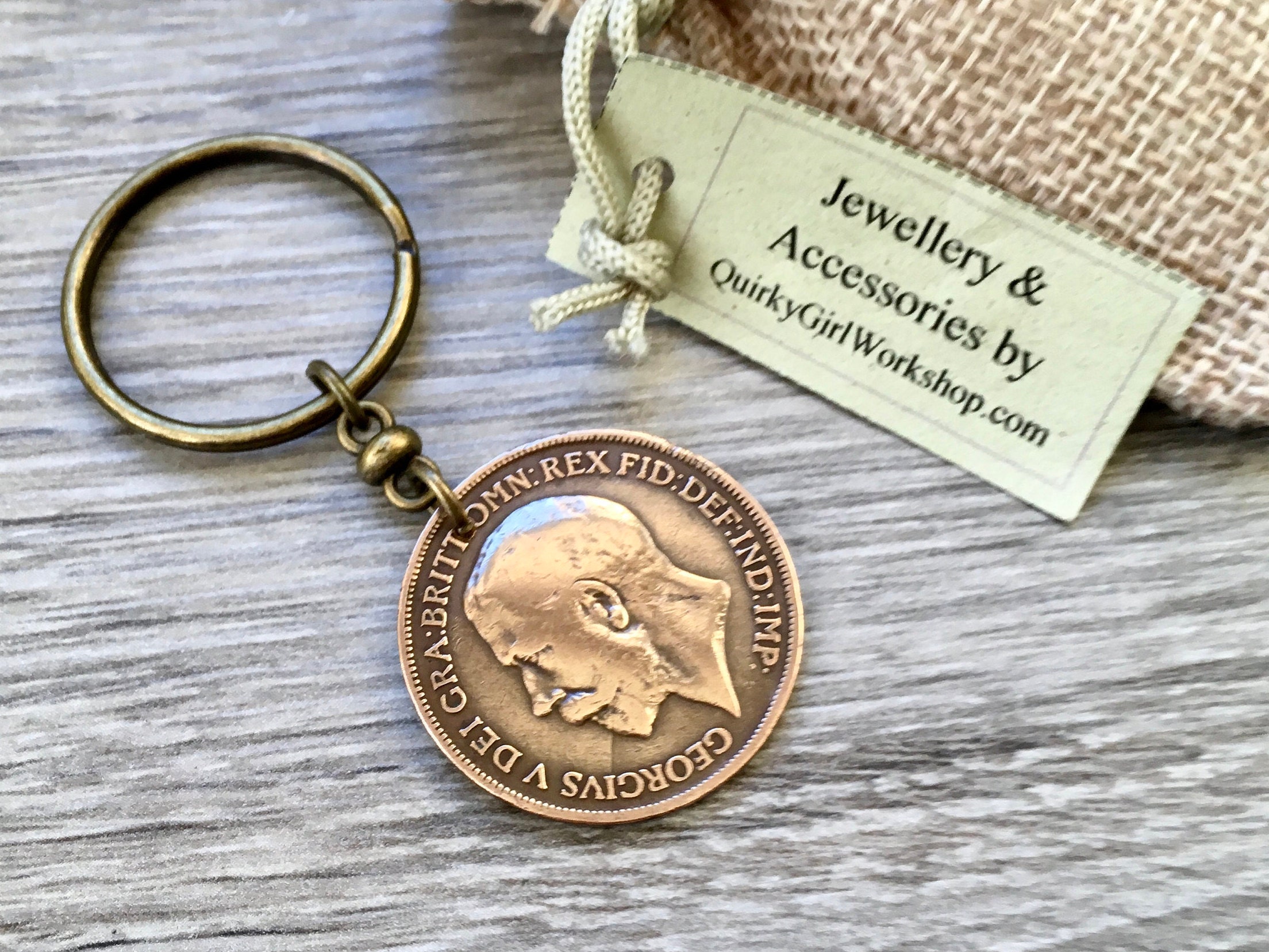 A 104 year old British big penny made into a keyring or clip, a penny ...