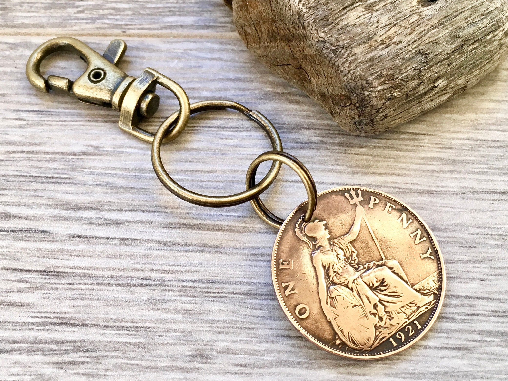 A 104 year old British big penny made into a keyring or clip, a penny ...