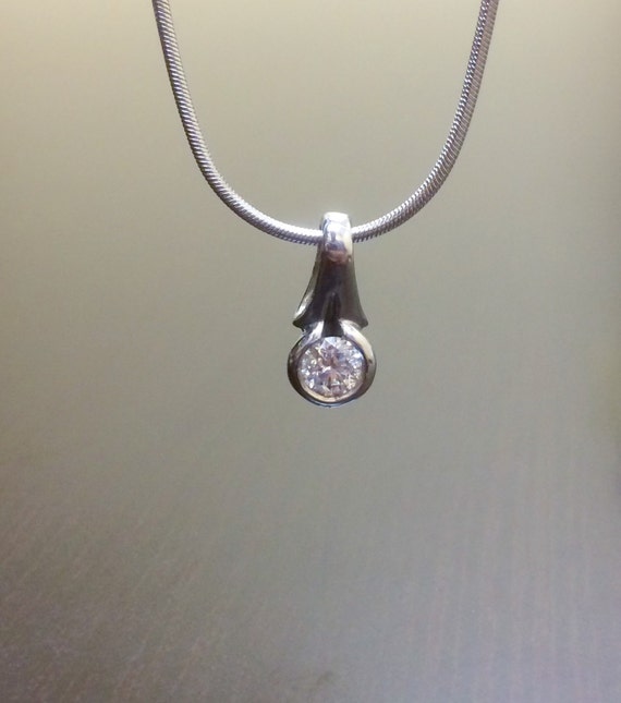 Bezel set diamond pendant store